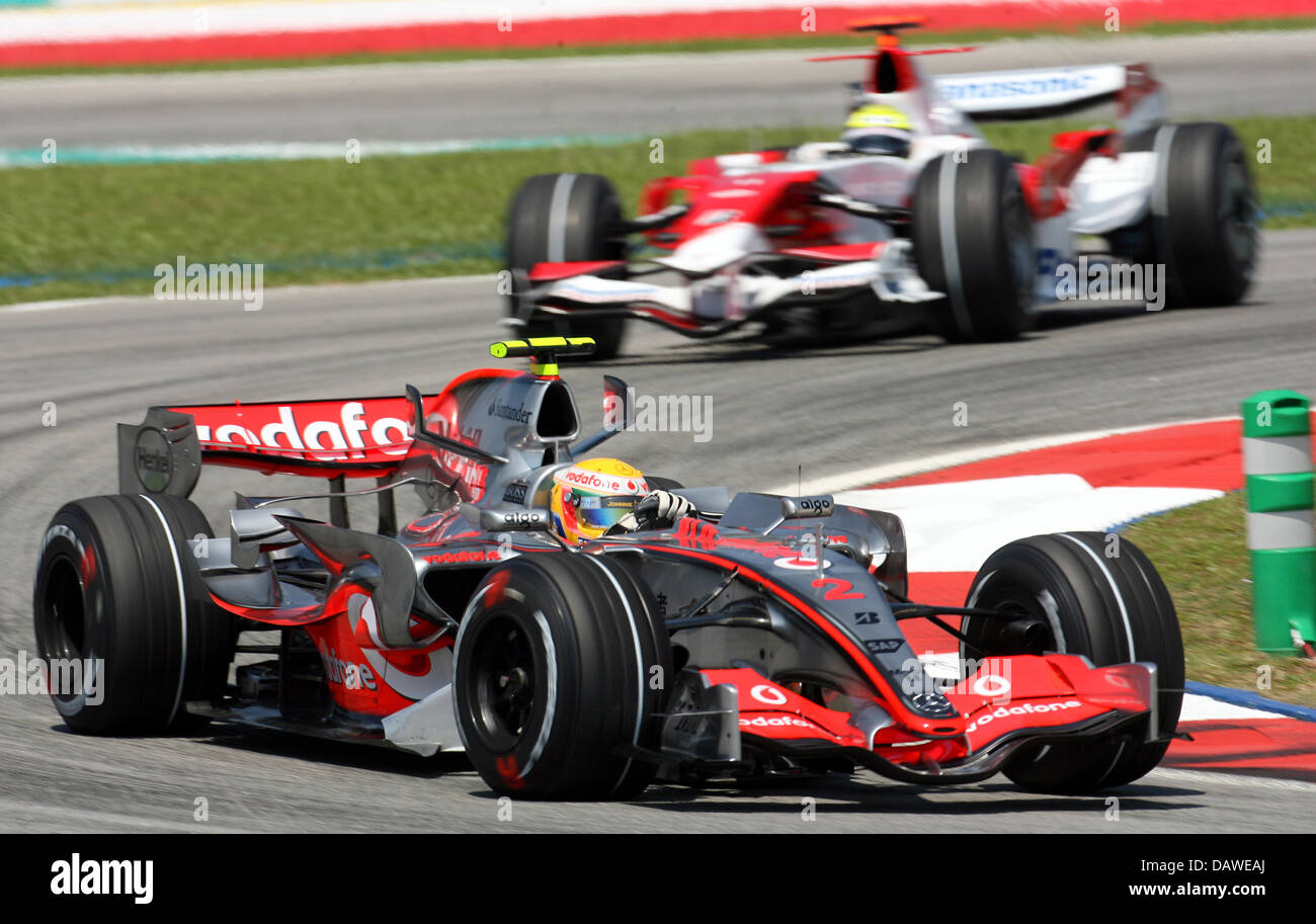 British Formula One driver Lewis Hamilton (front) of McLaren Mercedes ...