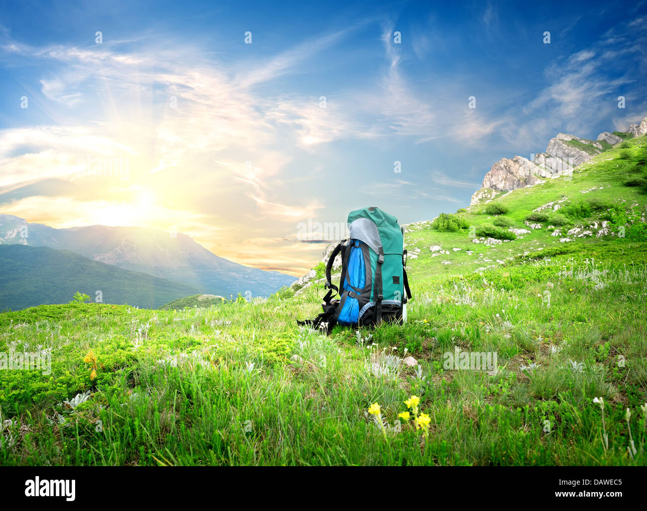Touristic backpack standing in a mountain valley Stock Photo - Alamy