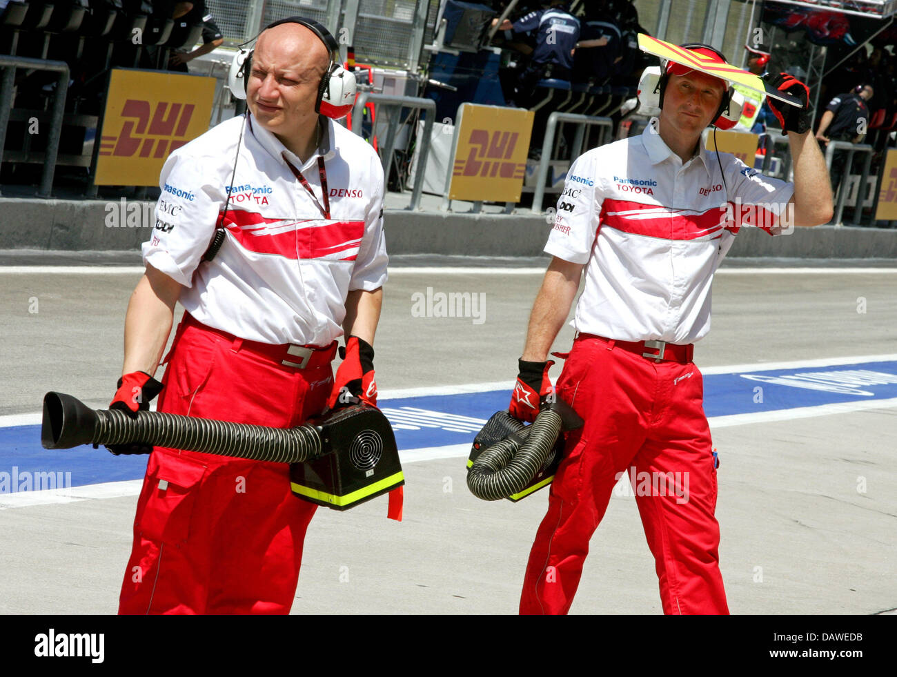 Toyota Racing team mechanics prepare for the drivers' pit stop during ...