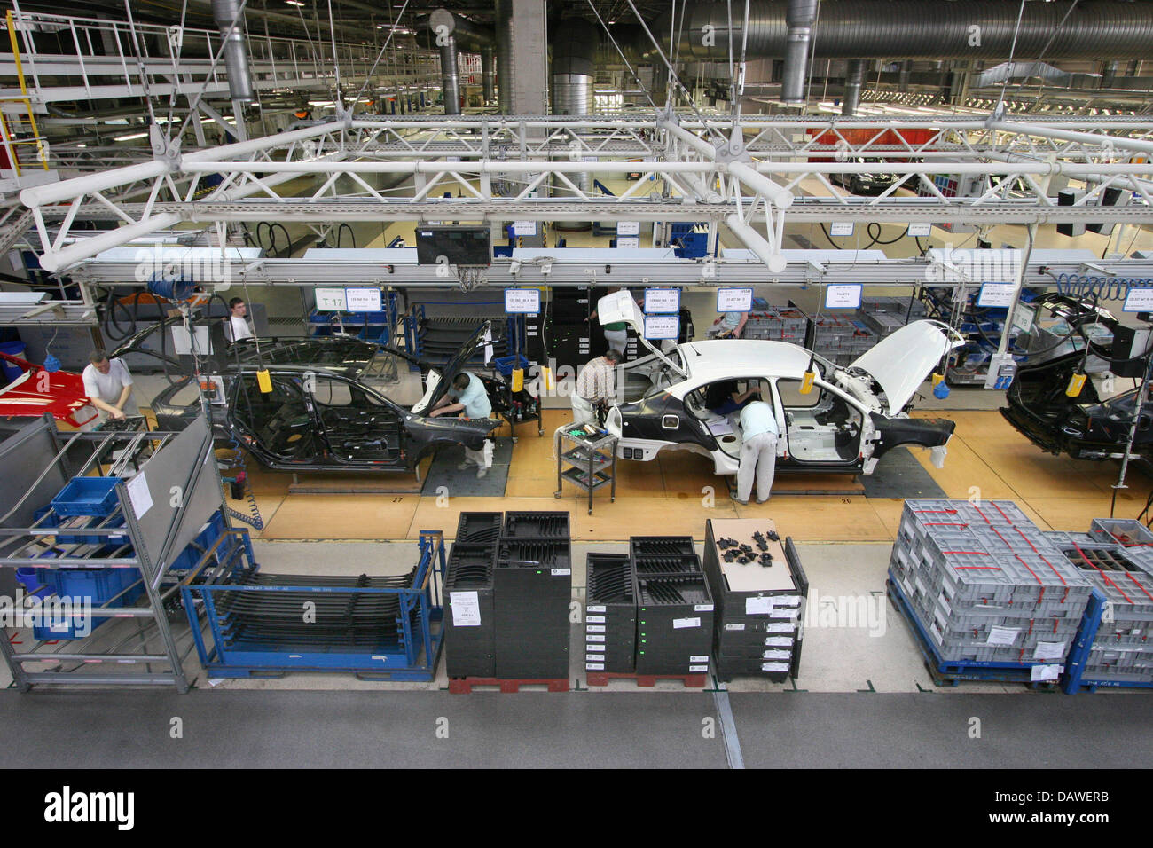 Men work on Skoda Octavia bodies at an assembly line in the Skoda plant ...