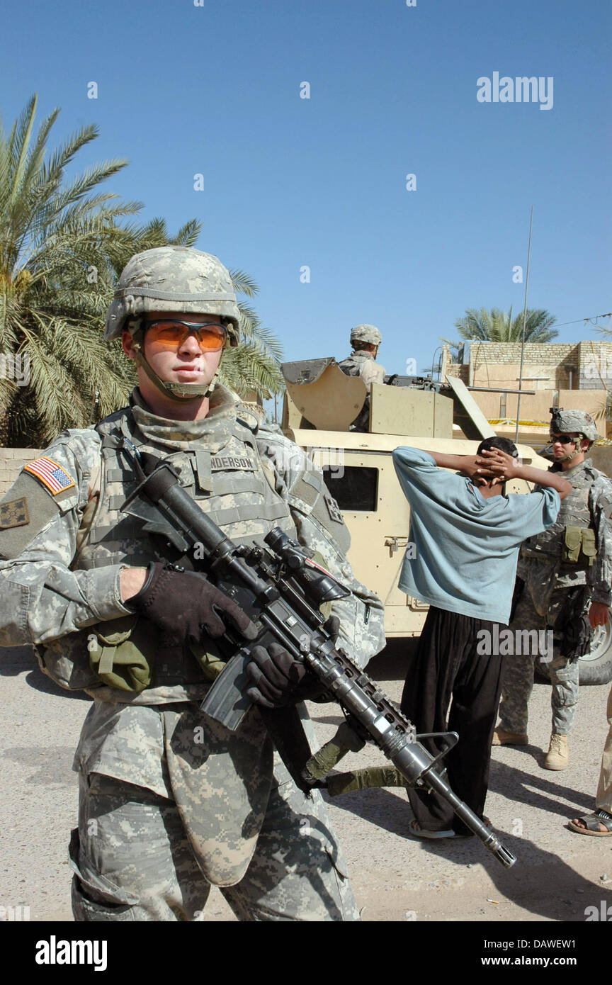 A soldier of the 1st Battalion of the 68th Armour Regiment stands guard ...