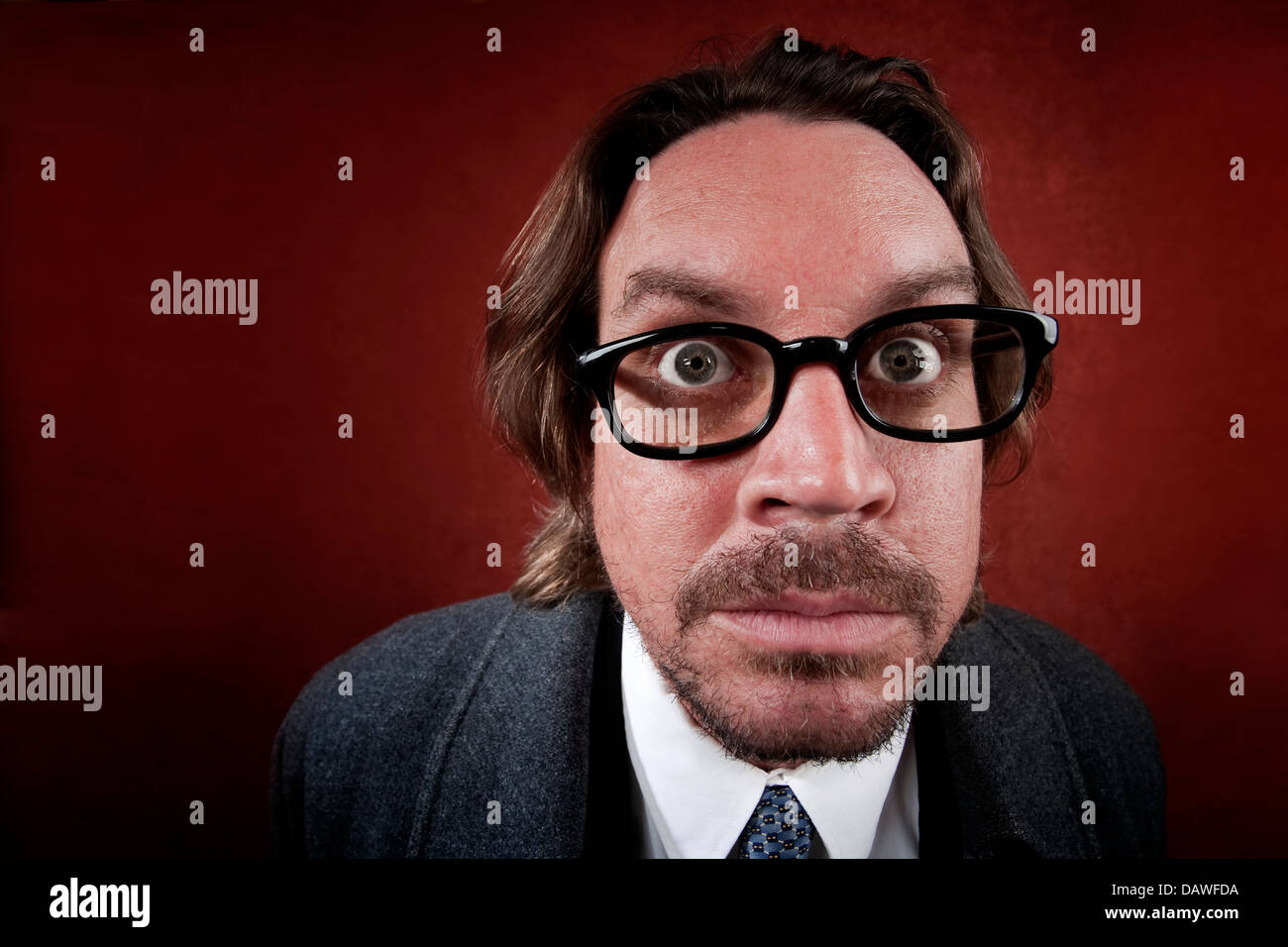 Puzzled Man with Glasses Stock Photo - Alamy