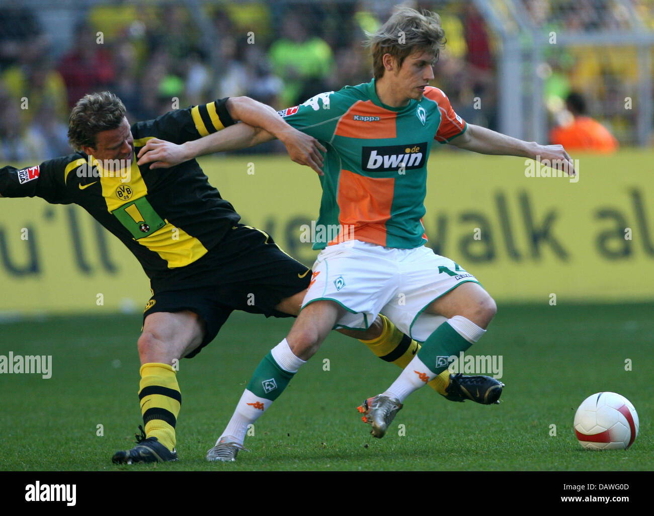 Christian Woerns (L) of Dortmund tries to steal the ball from Bremen's ...