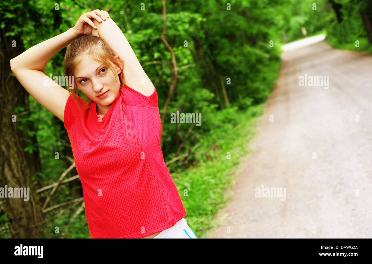 Woman In Red Running Stock Photo - Alamy