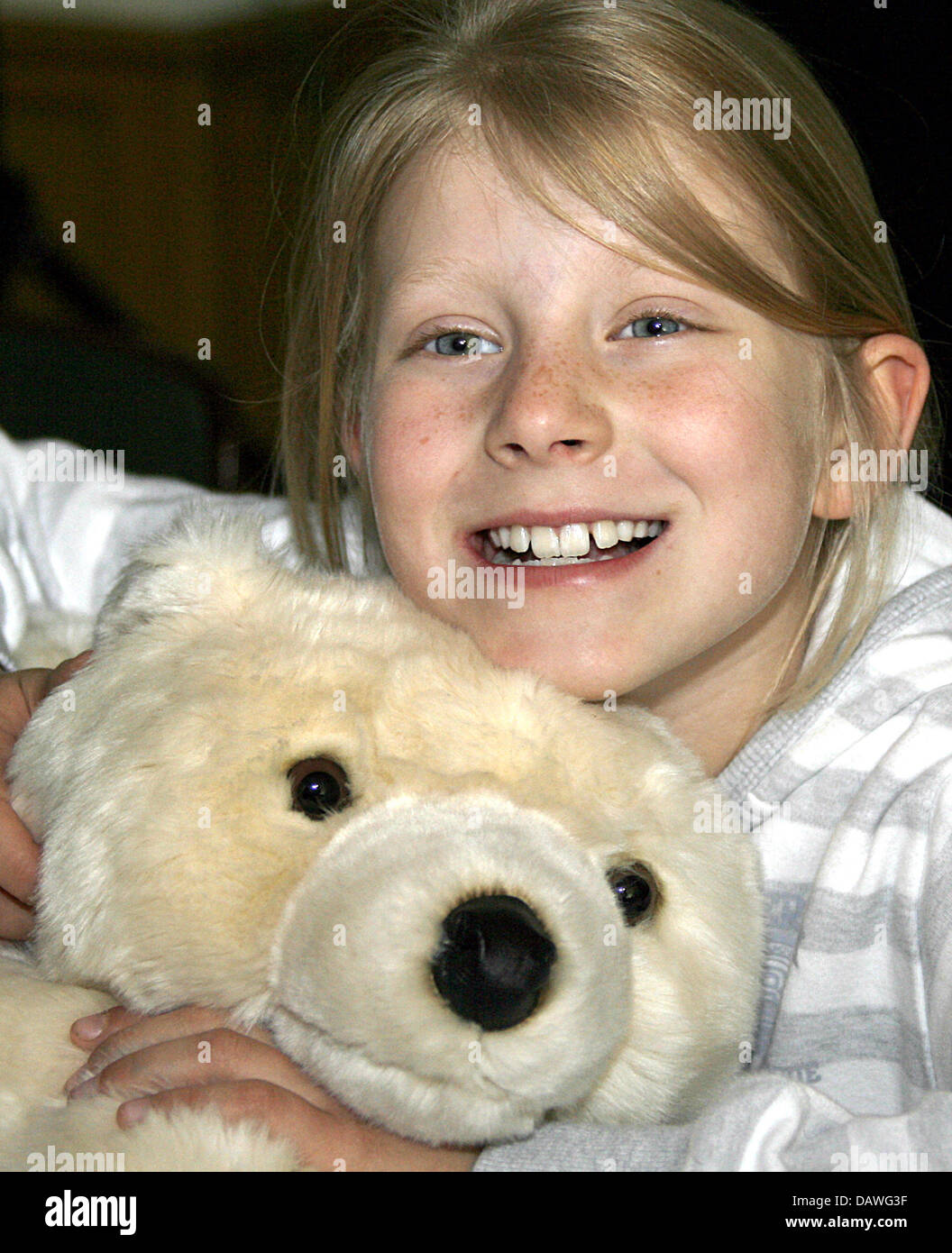 Seven year-old Lara fondly hugs a polar bear soft toy in Berlin, 17 ...