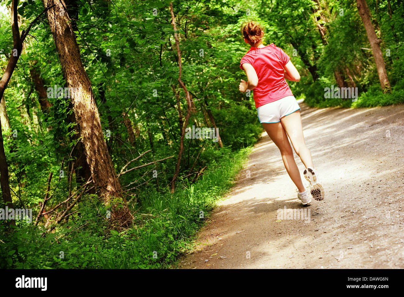 Woman In Red Running Stock Photo - Alamy