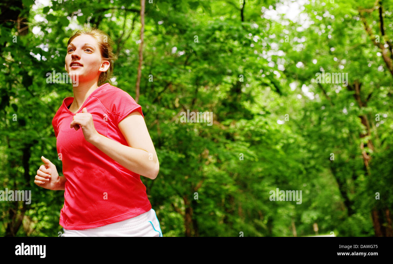 Woman In Red Running Stock Photo - Alamy