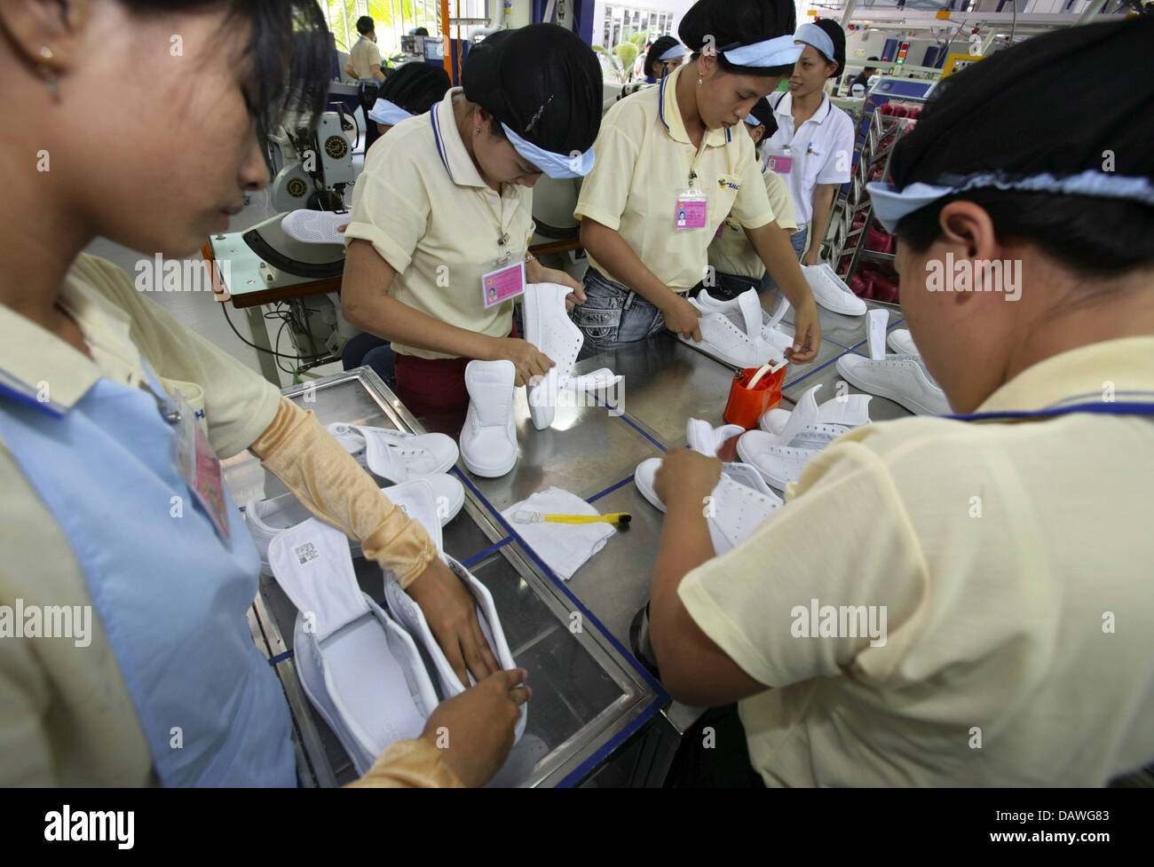 Female workers produce trainers at an Adidas plant in Ho Chi Minh City ...