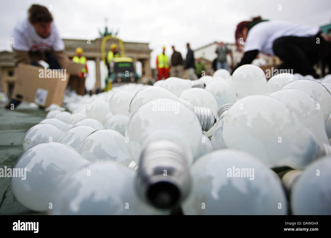 Greenpeace activists mount to destroy light bulbs with a roller at the ...
