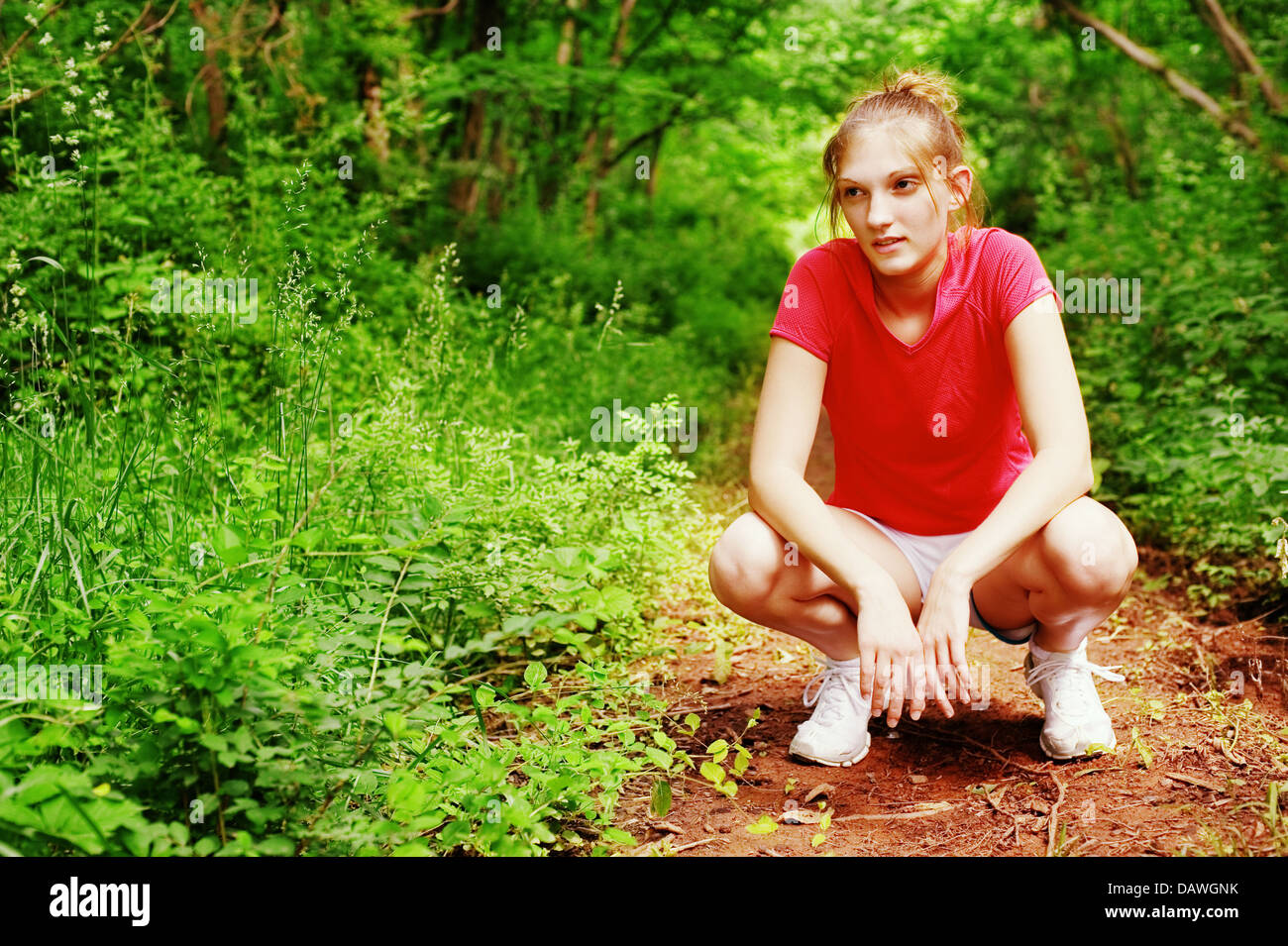 Woman In Red Running Stock Photo - Alamy