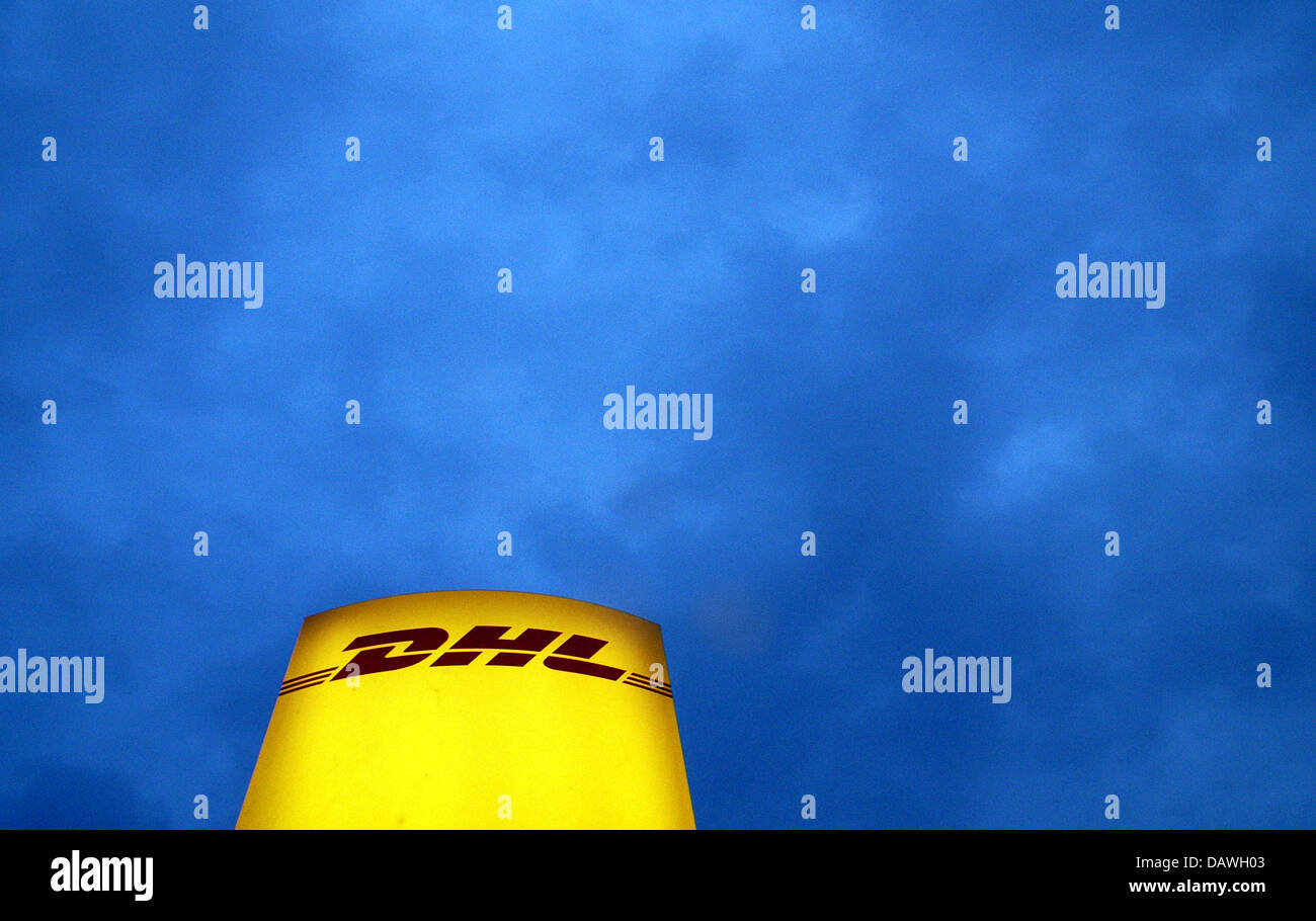 A sign with the logo of logistics company DHL pictured in Hamburg ...