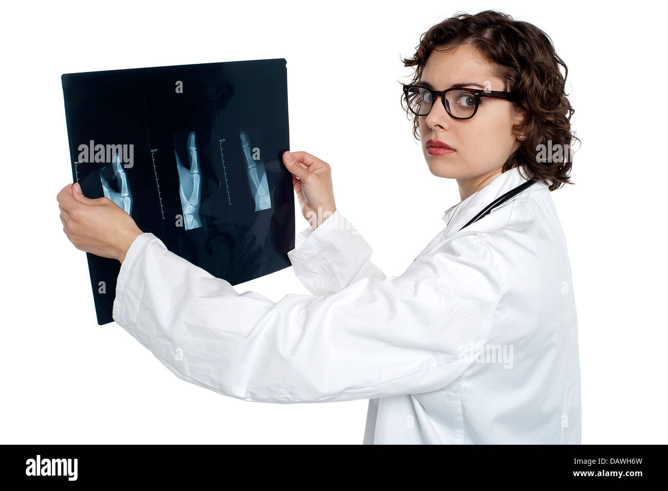 Serious female doctor showing the x-ray sheet Stock Photo - Alamy