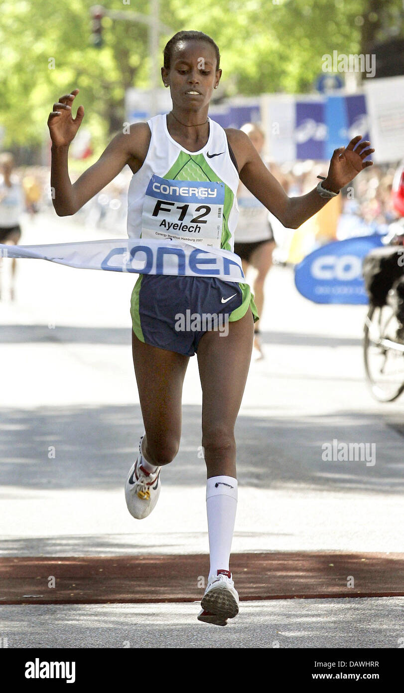 Ethiopian runner ayelech worku celebrates hi-res stock photography and ...