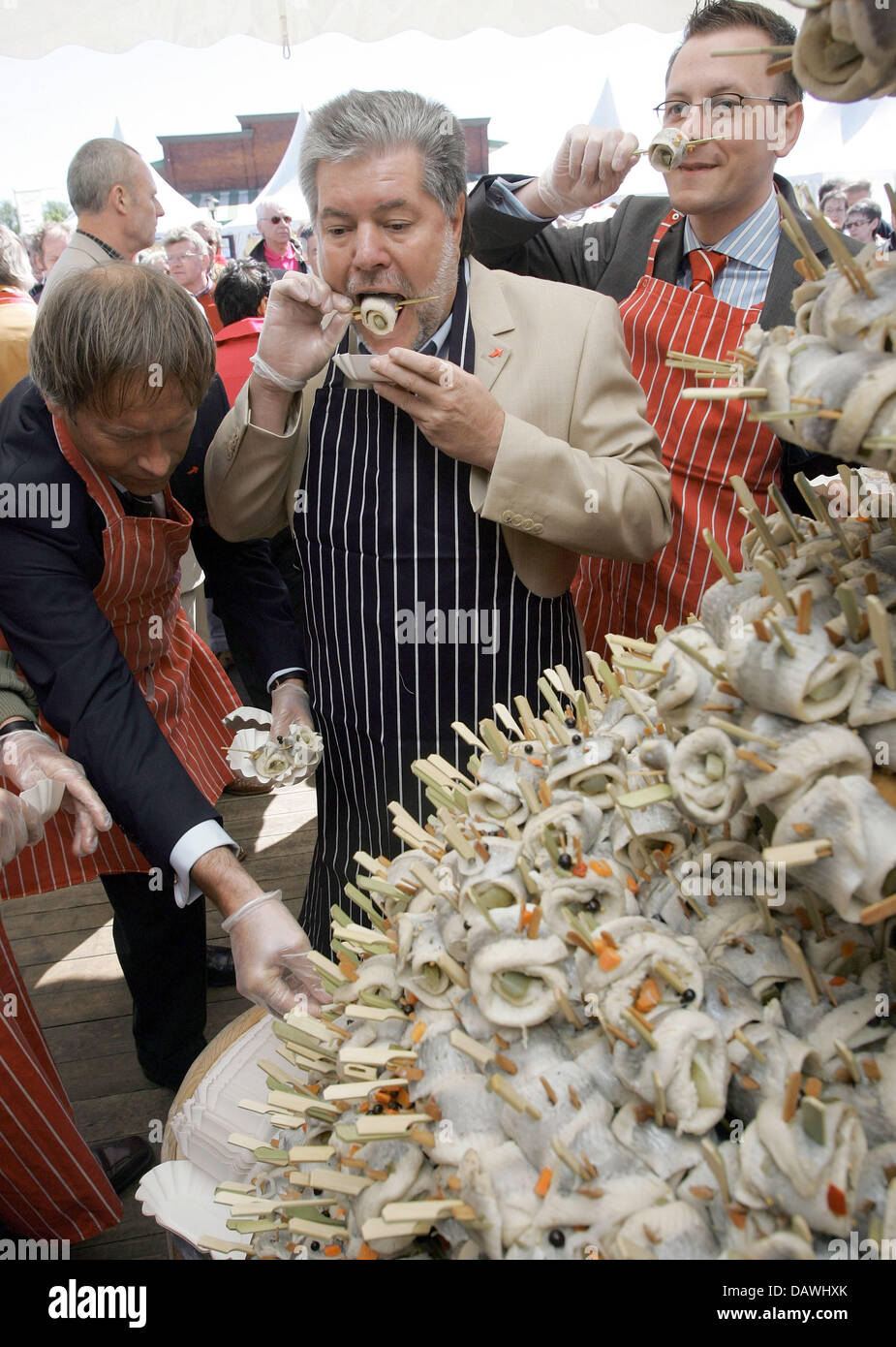 SPD leader tastes a rollmop from a rollmop tarte at the fish party in ...