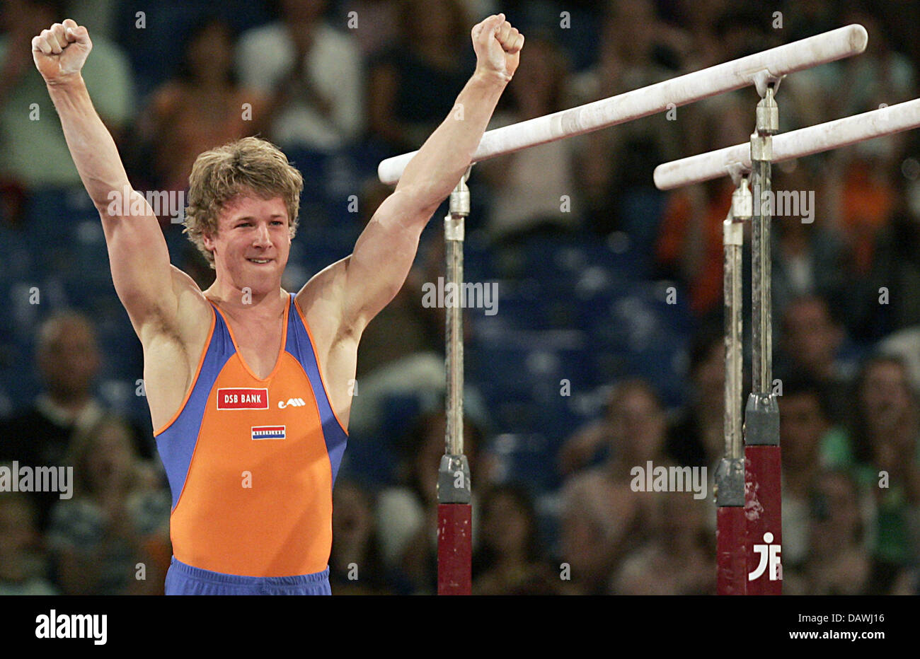 Dutch gymnast Epke Zonderland raises his arms in action during the ...