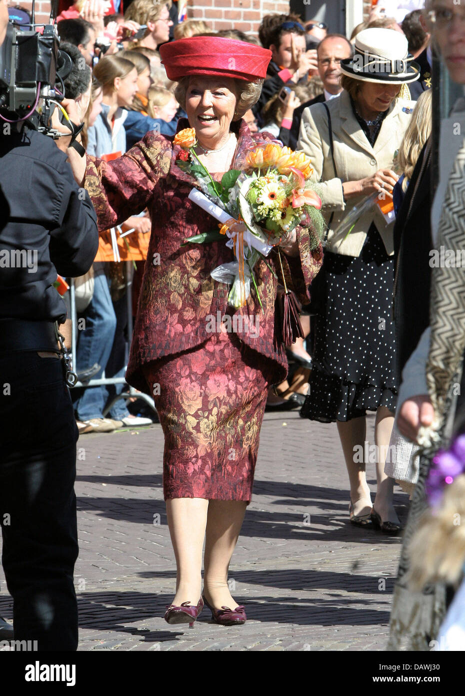 Dutch Queen Beatrix shown during her 'Queen's Day' visit to Woudrichen ...