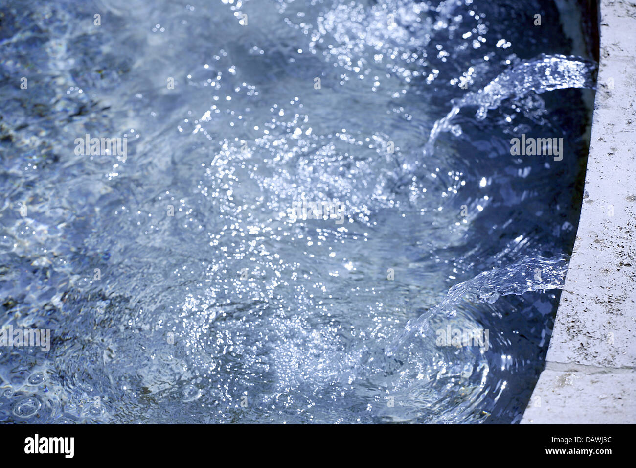 Water flows into a stone spring basin from different pipes in Frankfurt ...