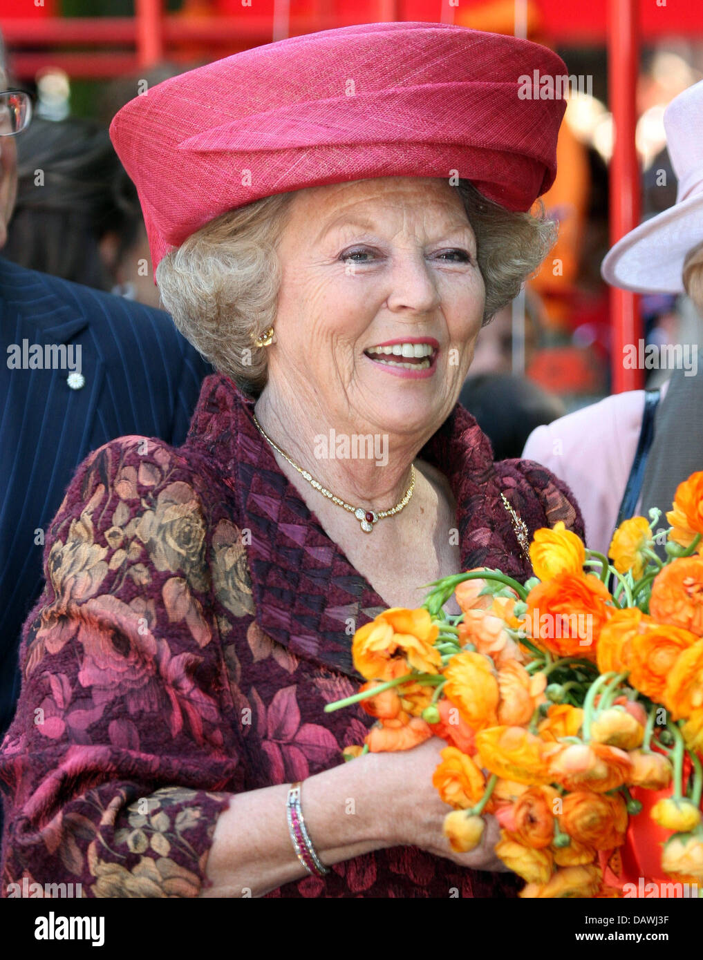 Dutch Queen Beatrix smiles with a bunch of flowers during her 'Queen's ...