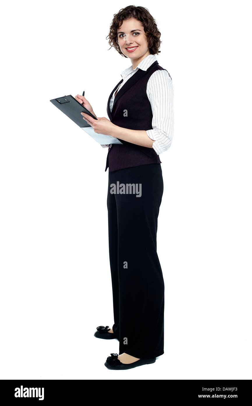 Charming business lady posing with a clipboard Stock Photo - Alamy