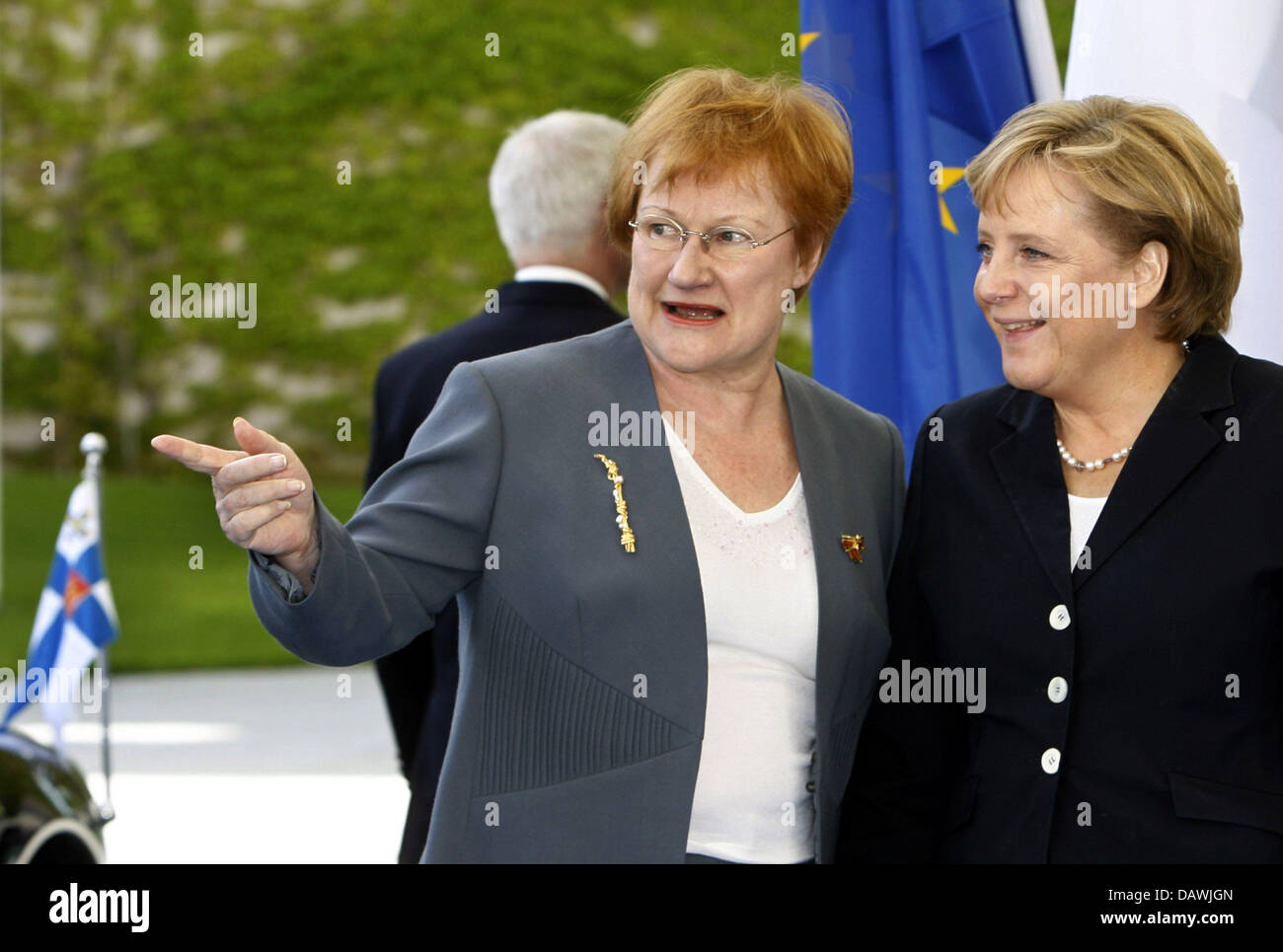 German Chancellor Angela Merkel (R) and the President of Finland, Tarja ...