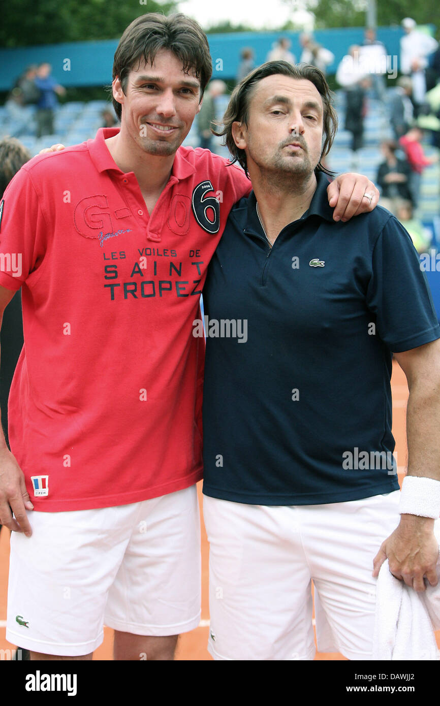 Former German tennis pro Michael Stich (L) is pictured with his ...