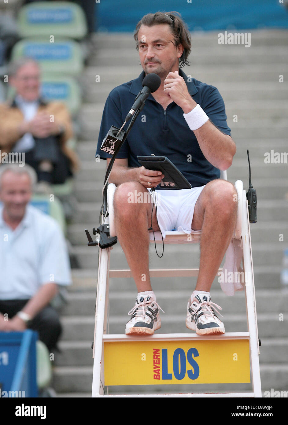 Former French tennis pro Henri Leconte sits on the referee's seat for a ...