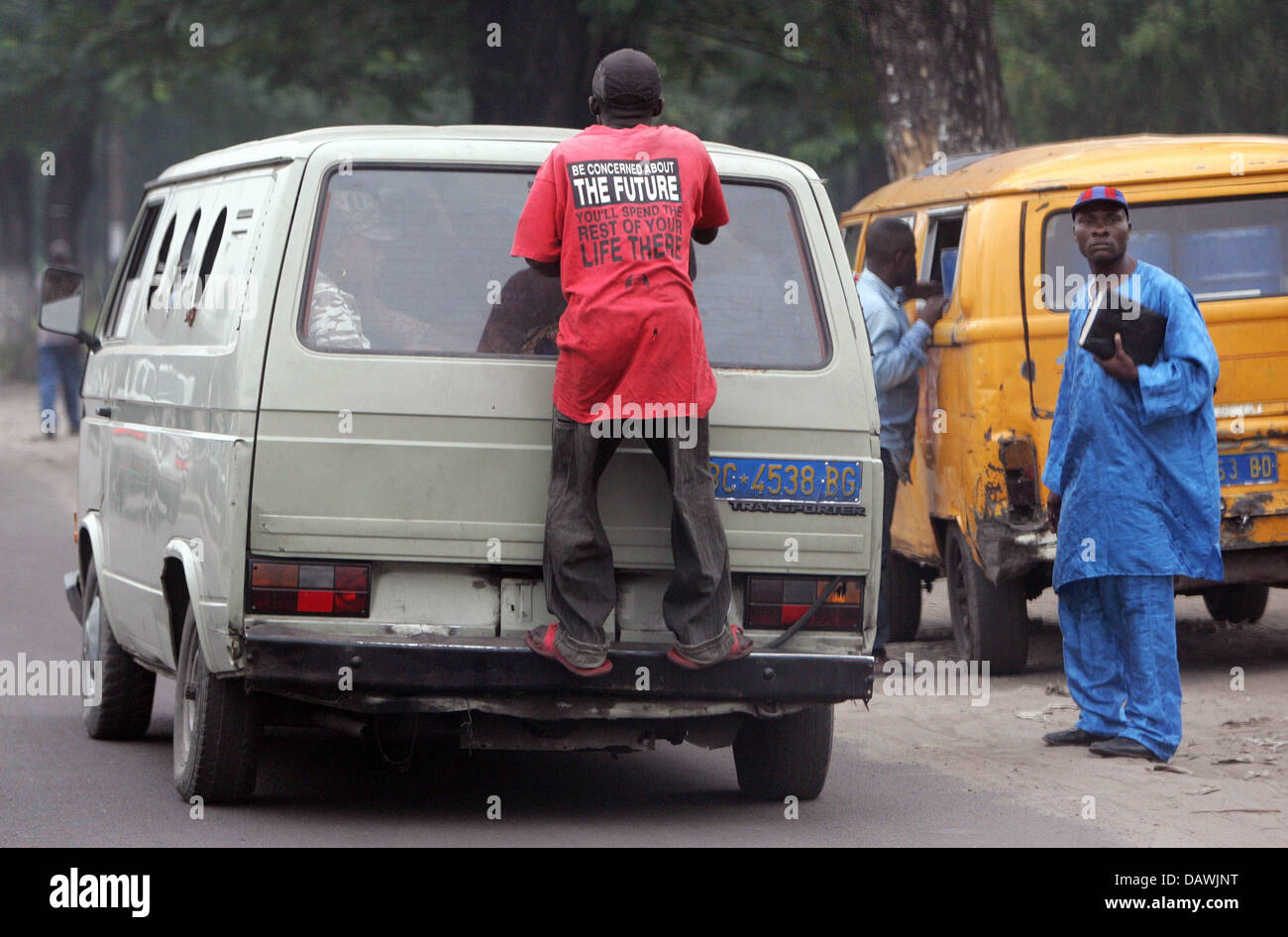 A Congolese rides a cab on its bumper in Kinshasa, DR Congo, 04 May ...