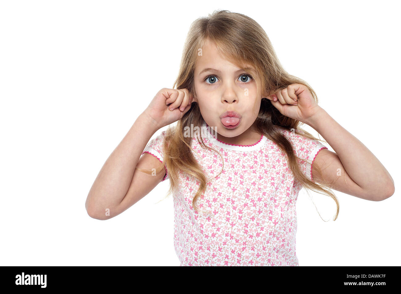 Fun loving girl child making faces Stock Photo - Alamy