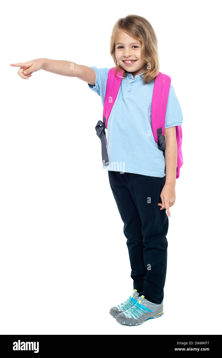 Smiling young kid pointing away Stock Photo - Alamy