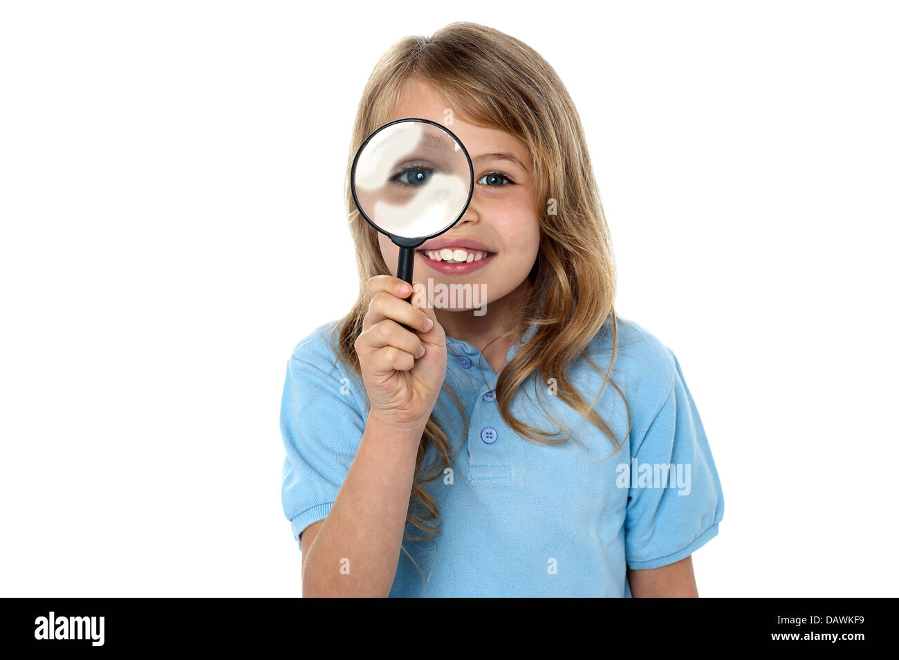 Smiling kid with magnifying glass Stock Photo - Alamy