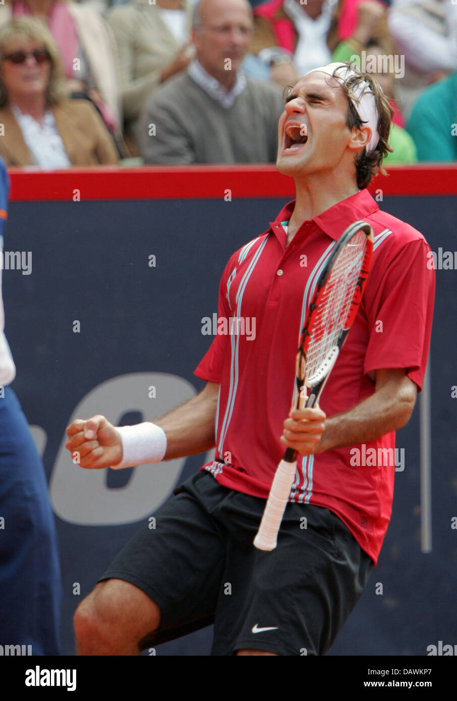 Swiss tennis professional Roger Federer cries out in joy after winning ...
