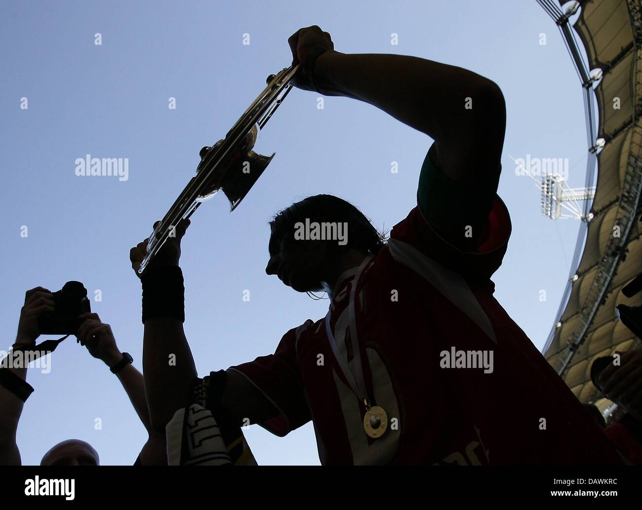VfB Stuttgart team captain holds up the championship shield after the ...