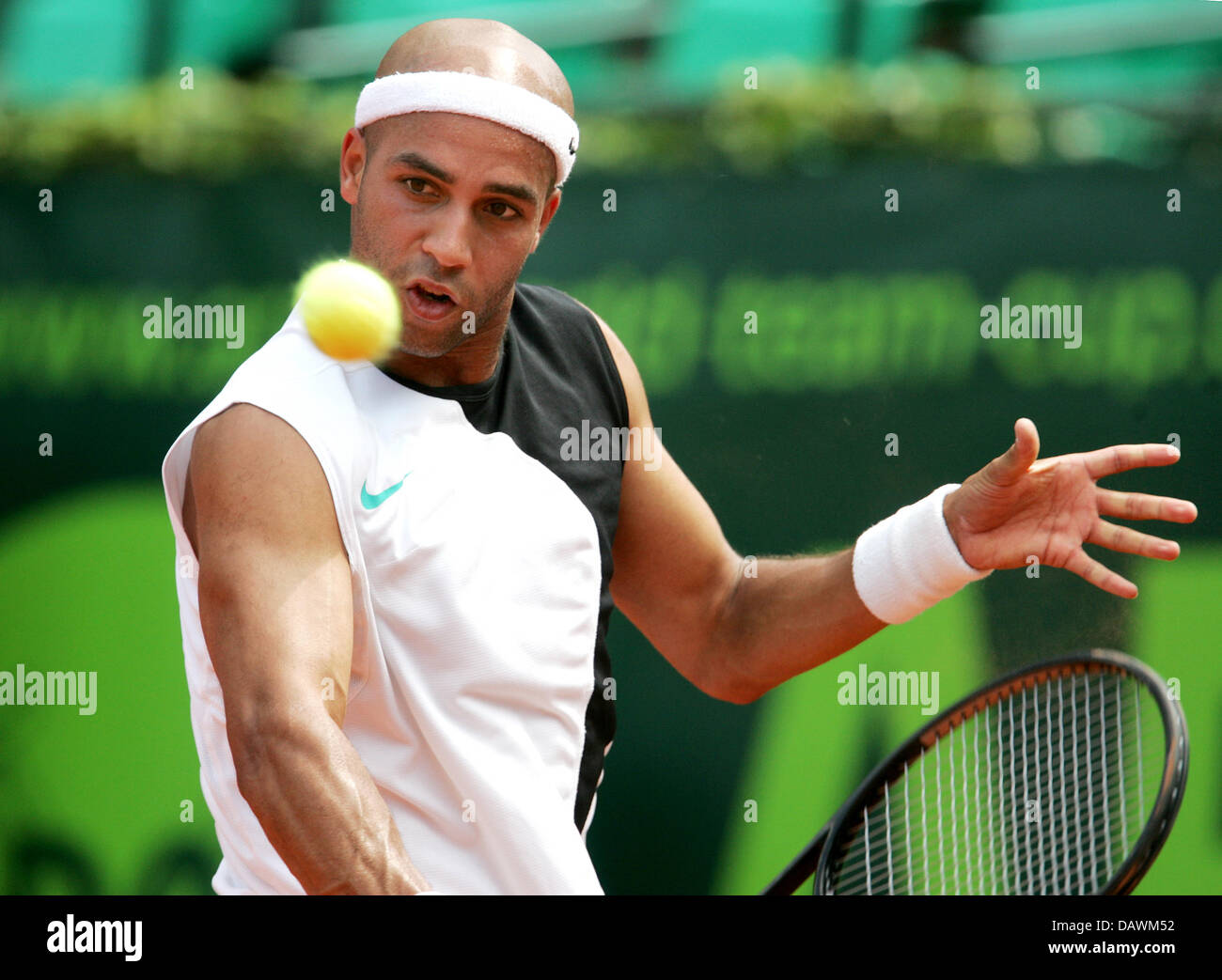 US tennis pro James Blake sneaks a backhand during his match against ...