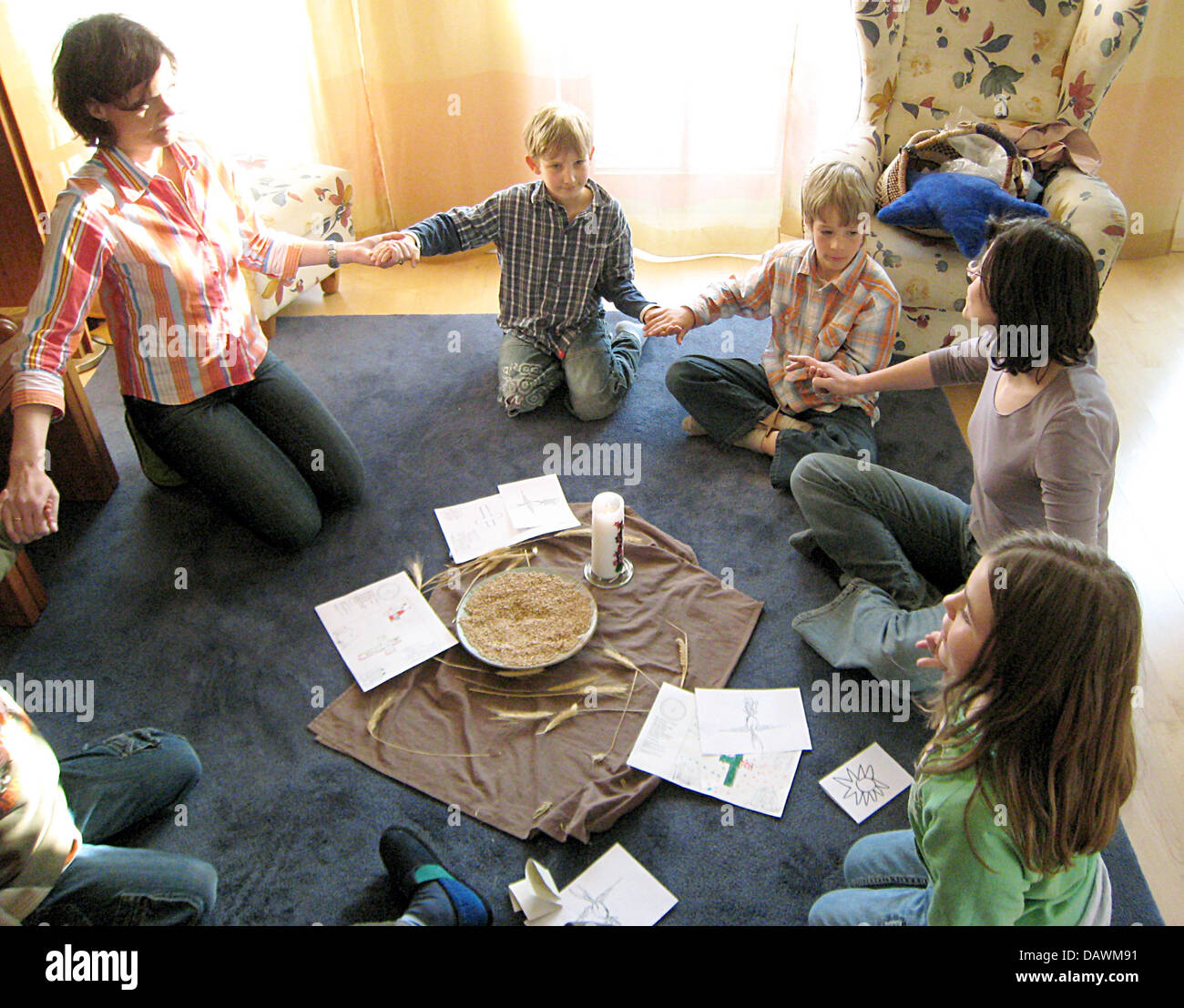 Teacher and children pray in preparance for their First Communion in ...
