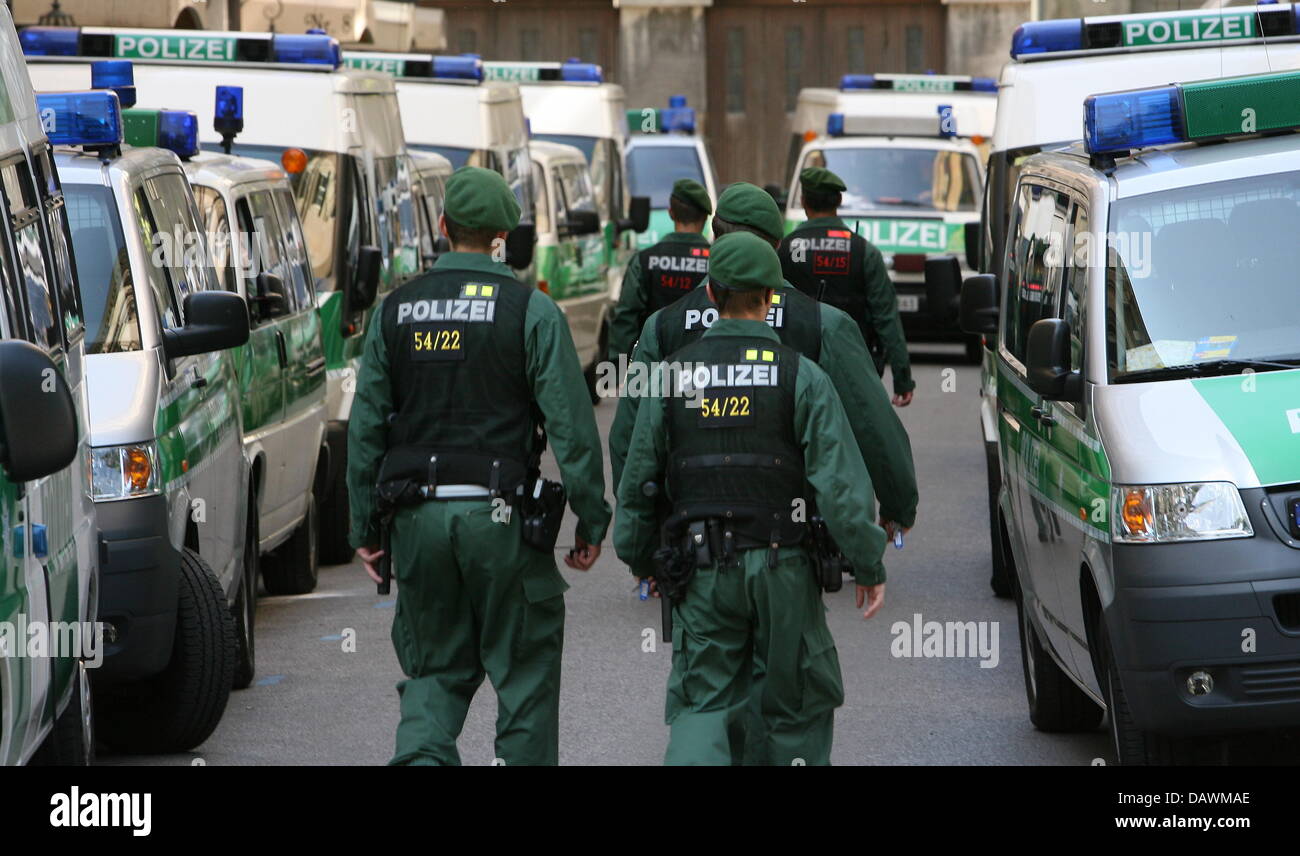 A massive force of police guards the hotel where the G8 Ministers of ...