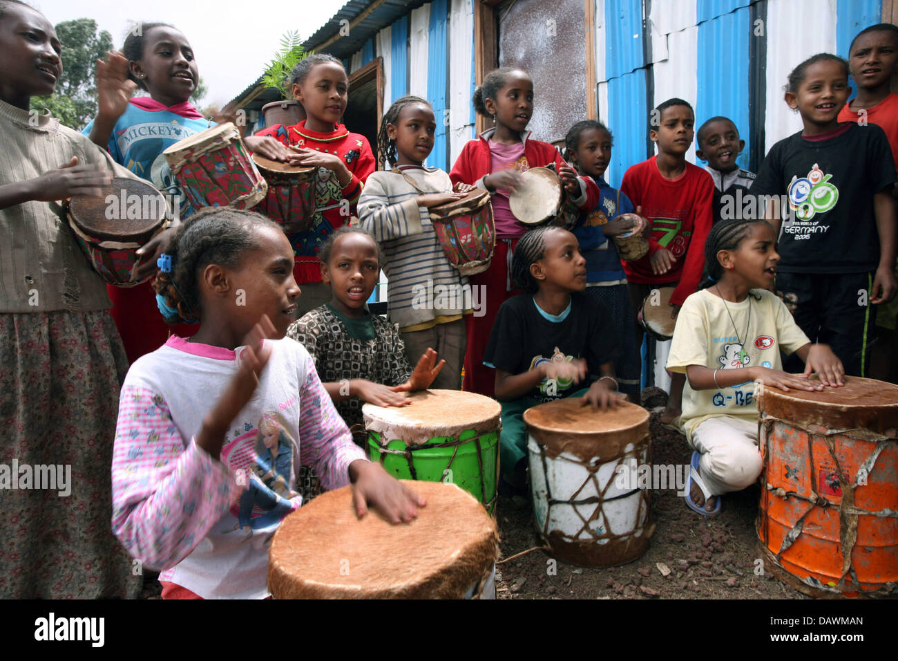 Ethiopian orphans sing and make music at an aide project of the Agro ...