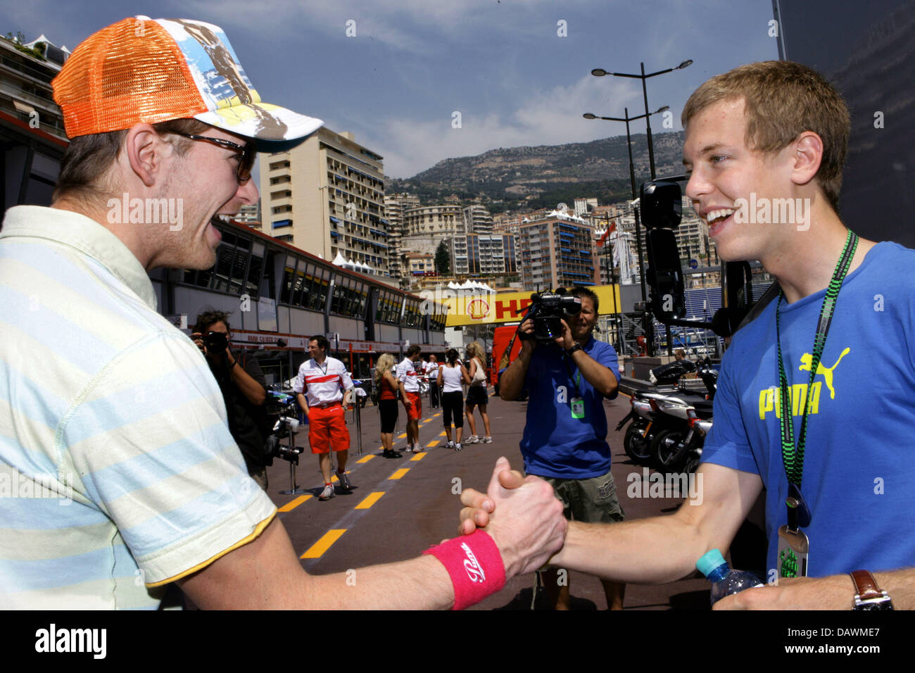 German Formula One test driver Sebastian Vettel of BMW Sauber (R) and ...