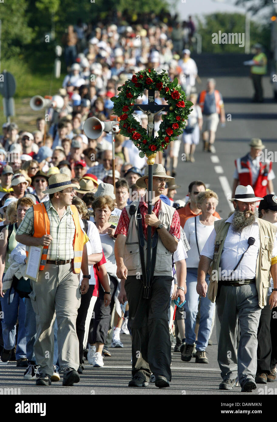 A long column of pilgrims walks across the 'Islinger Feld' during ...