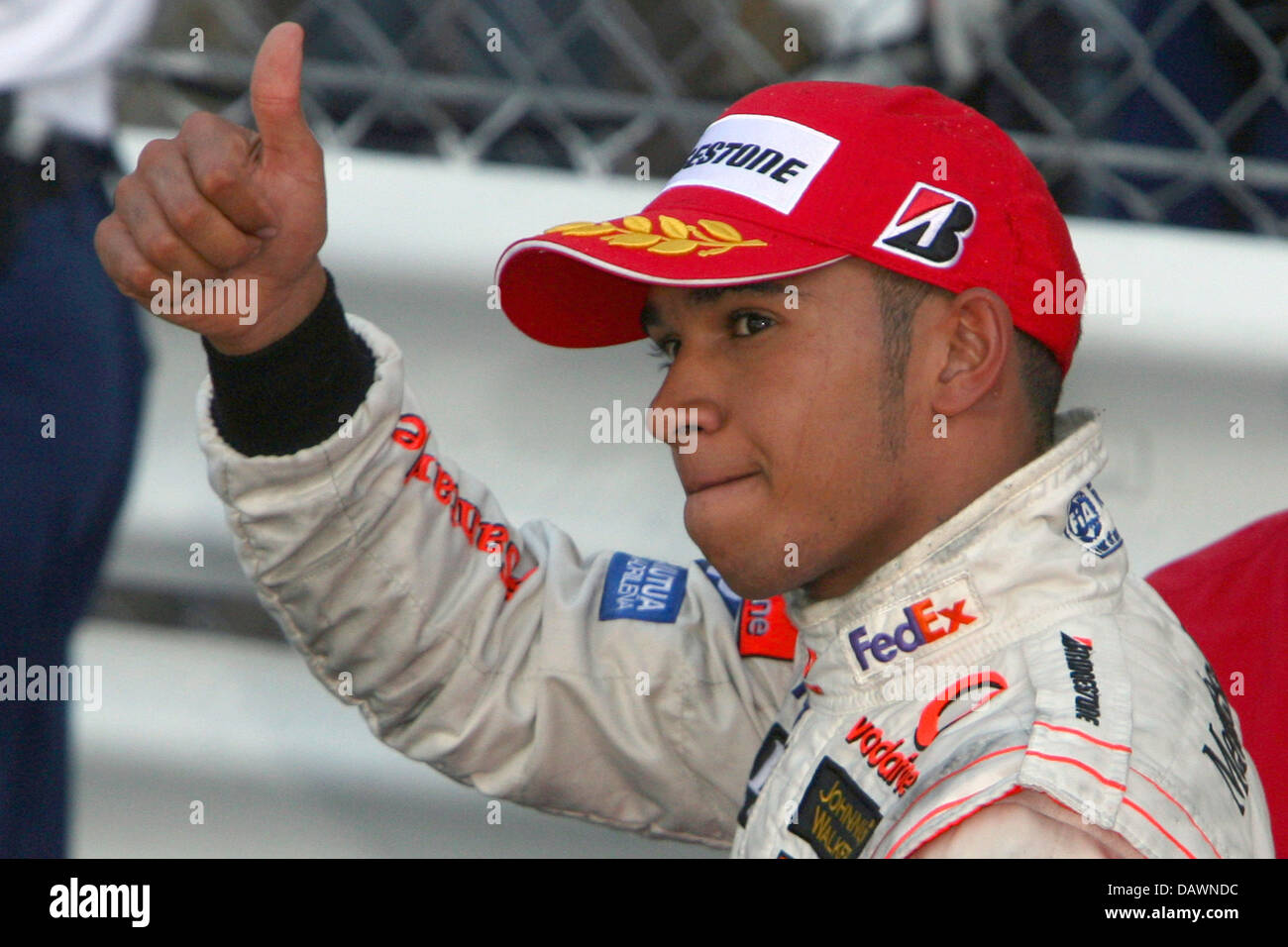 Second placed Lewis Hamilton of McLaren Mercedes gives a thumbs up ...