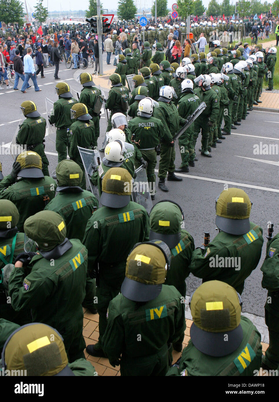 Masive police array leads the G8 protesters to the harbour during a ...