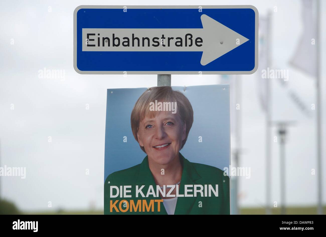 A poster announces the visit of chancellor Merkel in Neuharlingersiel ...
