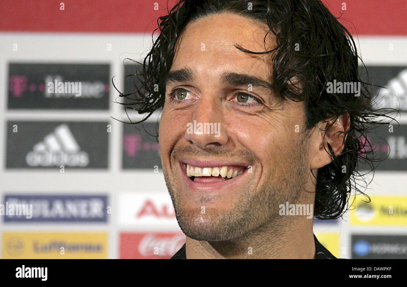Bundesliga club Bayern Munich's new signed striker Luca Toni smiles at ...
