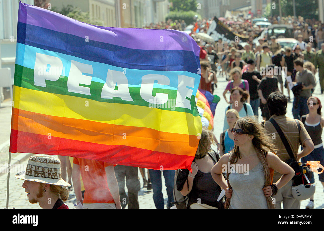G8 protesters wave the rainbow coloured flags at the closing rally in ...