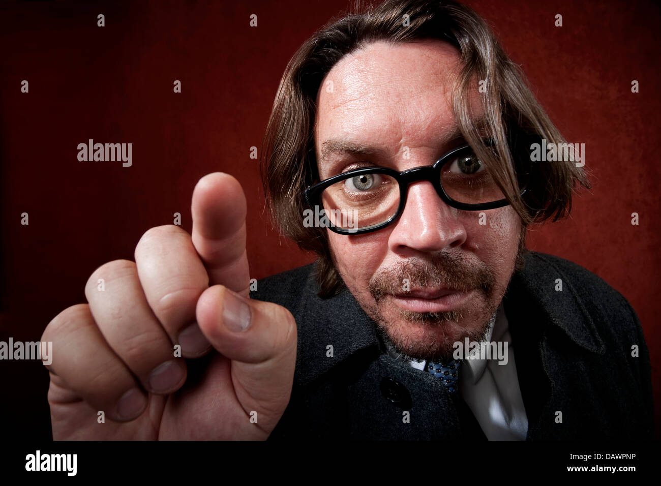Puzzled Man with Glasses Stock Photo - Alamy