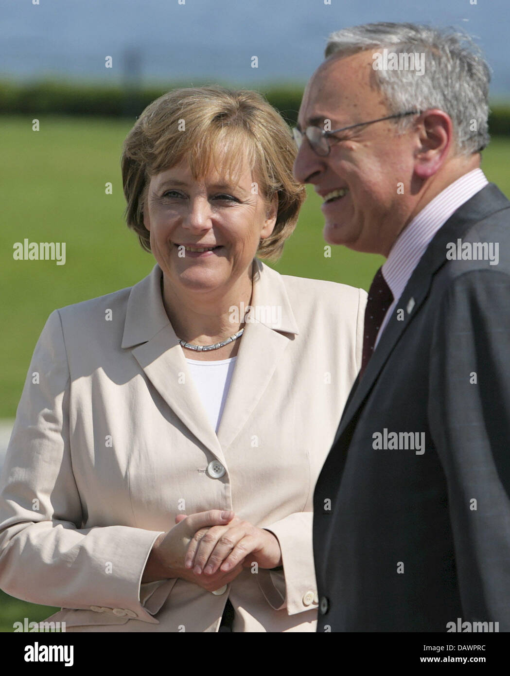 German Chancellor Angela Merkel (L) welcomes Claude Mandil (R ...