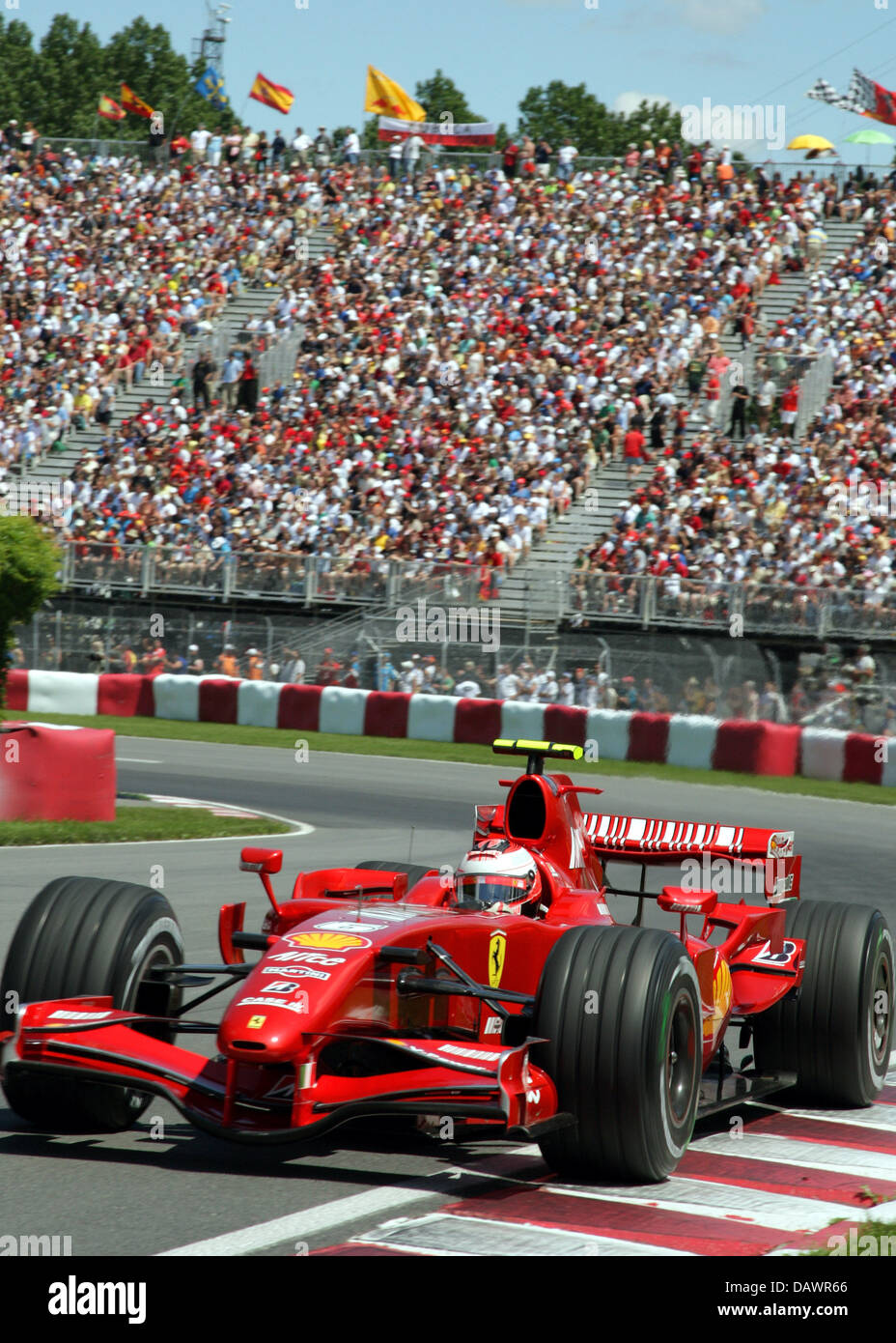 Finnish Formula One driver Kimi Raikkonen of Scuderia Ferrari steers ...