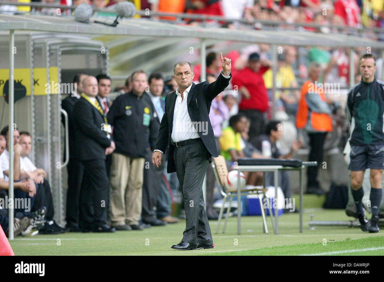 Turkey head coach Fatih Terim (C) gestures from the sideline during the ...