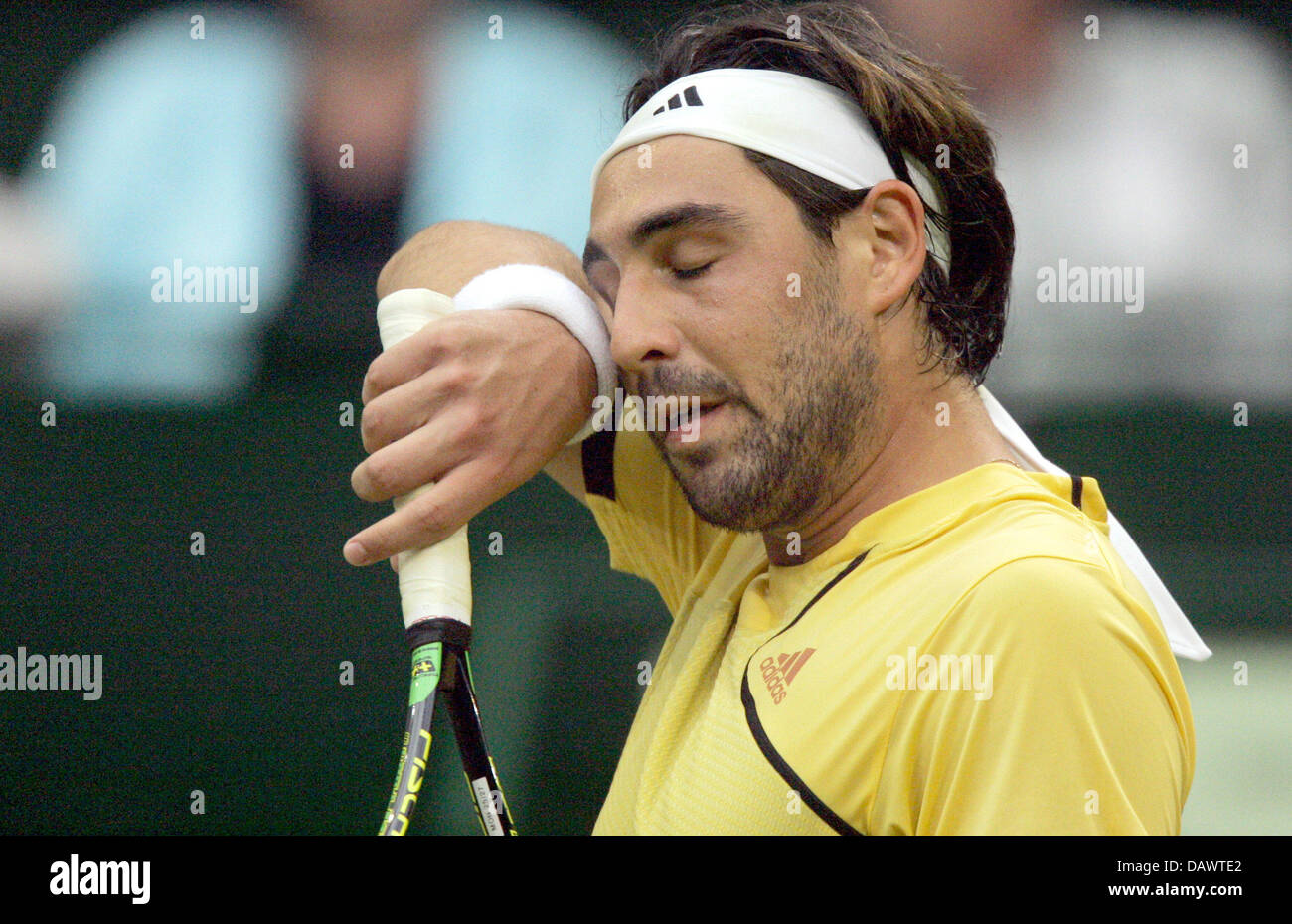 Cypriot tennis pro Marcos Baghdatis wipes off the sweat during his ...
