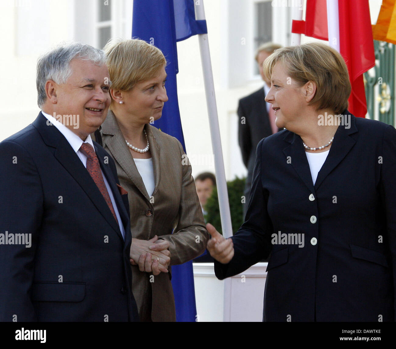 German Chancellor Angela Merkel (R) welcomes Polish President Lech ...