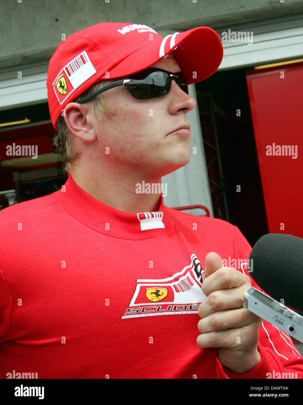 Finnish Formula One driver Kimi Raikkonen of Scuderia Ferrari gives an ...